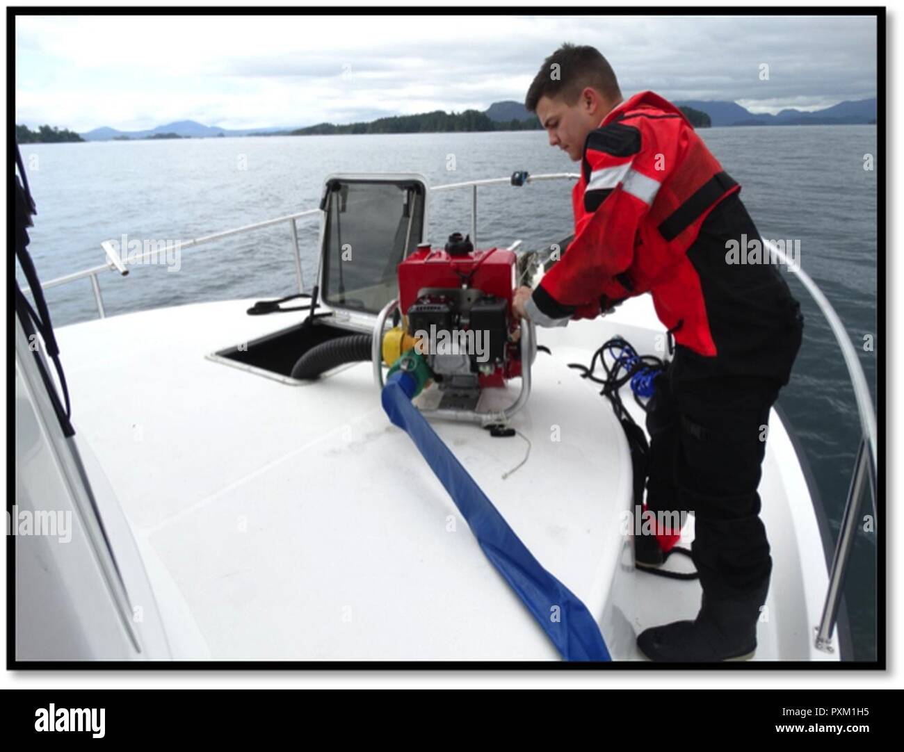 Petty Officer 2nd Class Derrick Depriest, a damage controlman on board ...