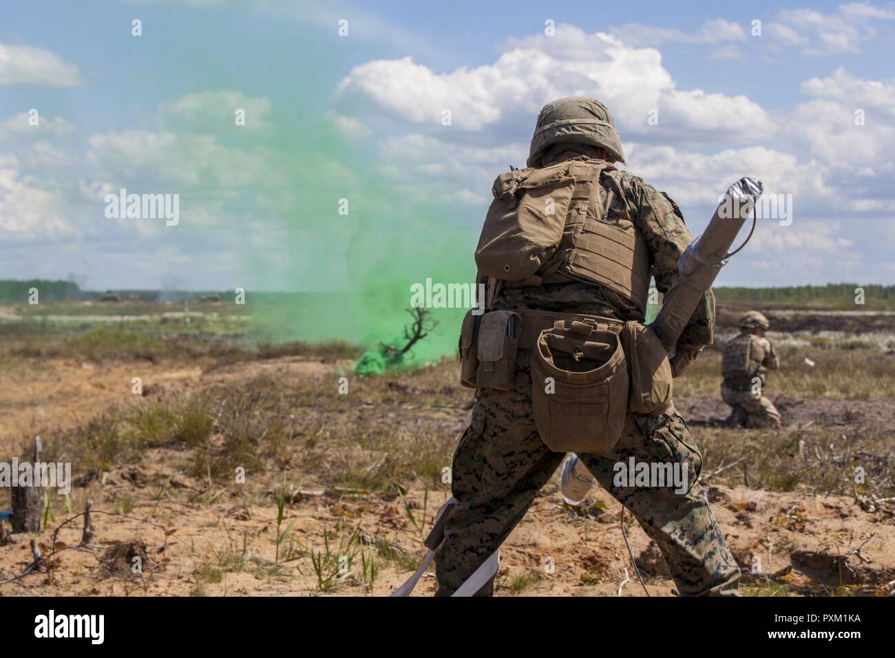 British Royal Marines provide cover as U.S. Marines place C4 explosives ...