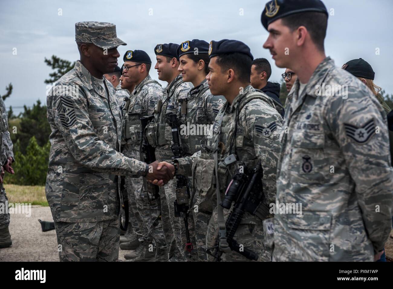 Chief Master Sgt. of the Air Force Kaleth O. Wright shakes hands with ...