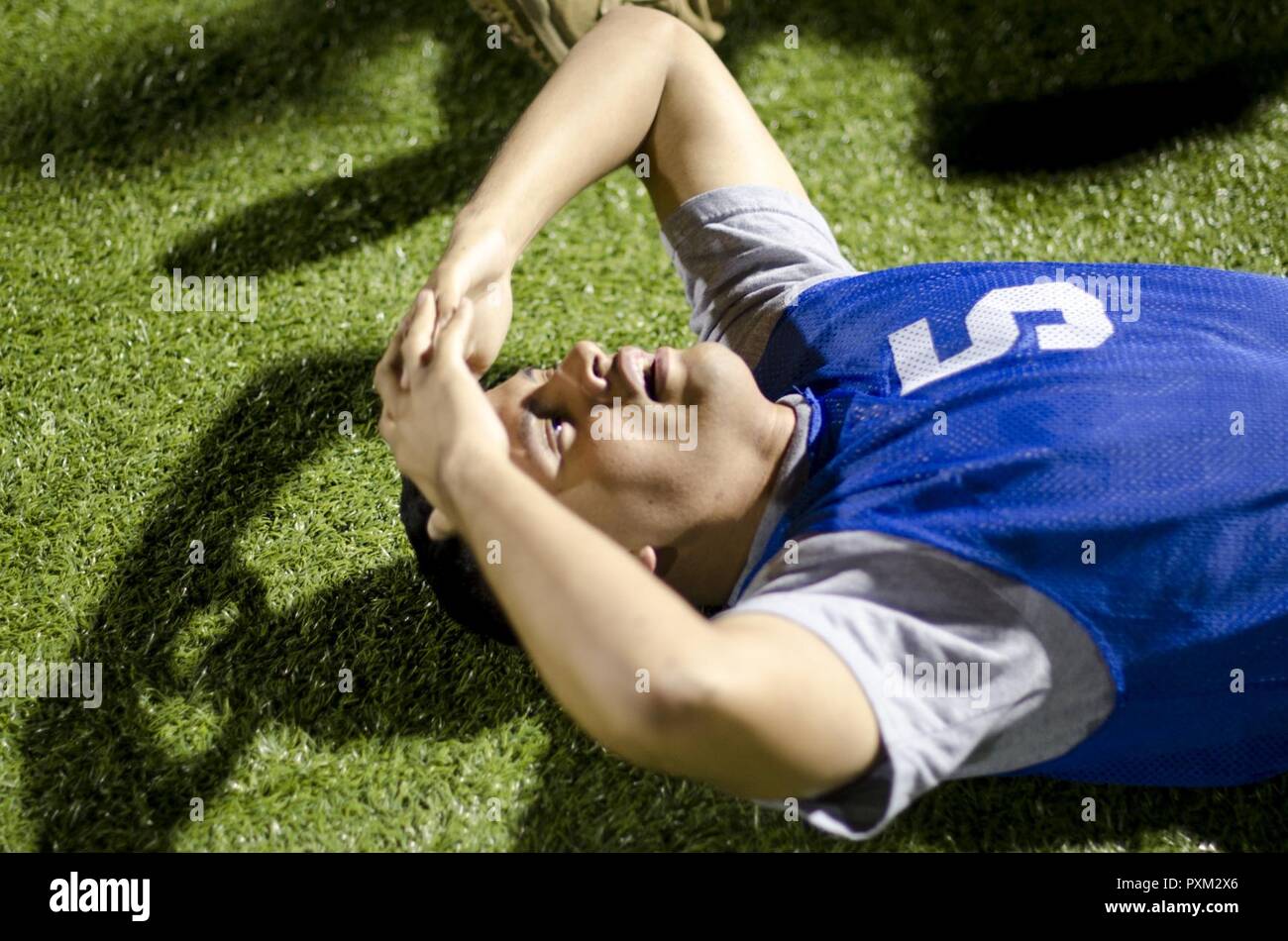 After conducting sit-ups for an Army Physical Fitness Test, a moment of ...