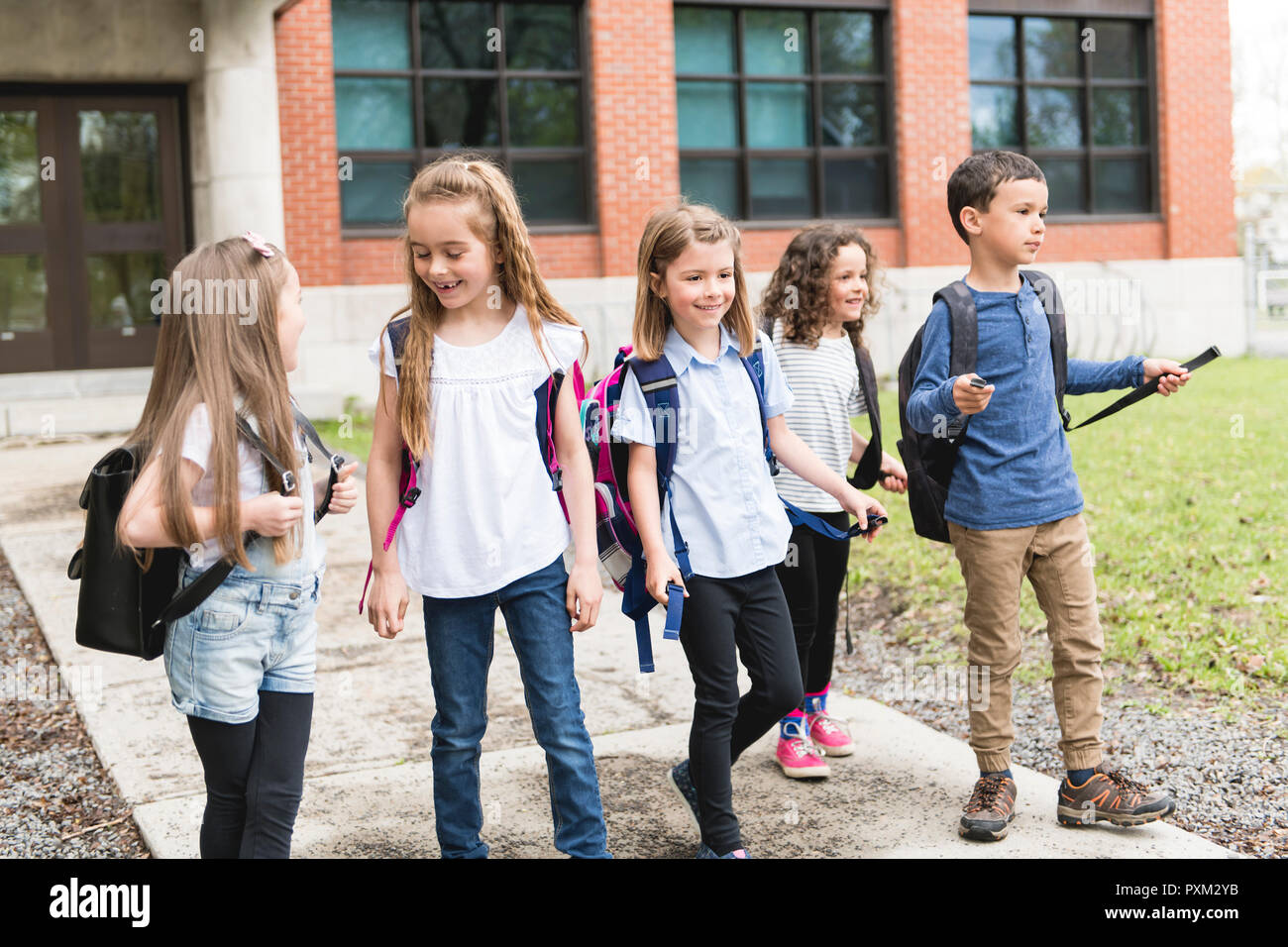 Group of students outside at school standing together Stock Photo - Alamy