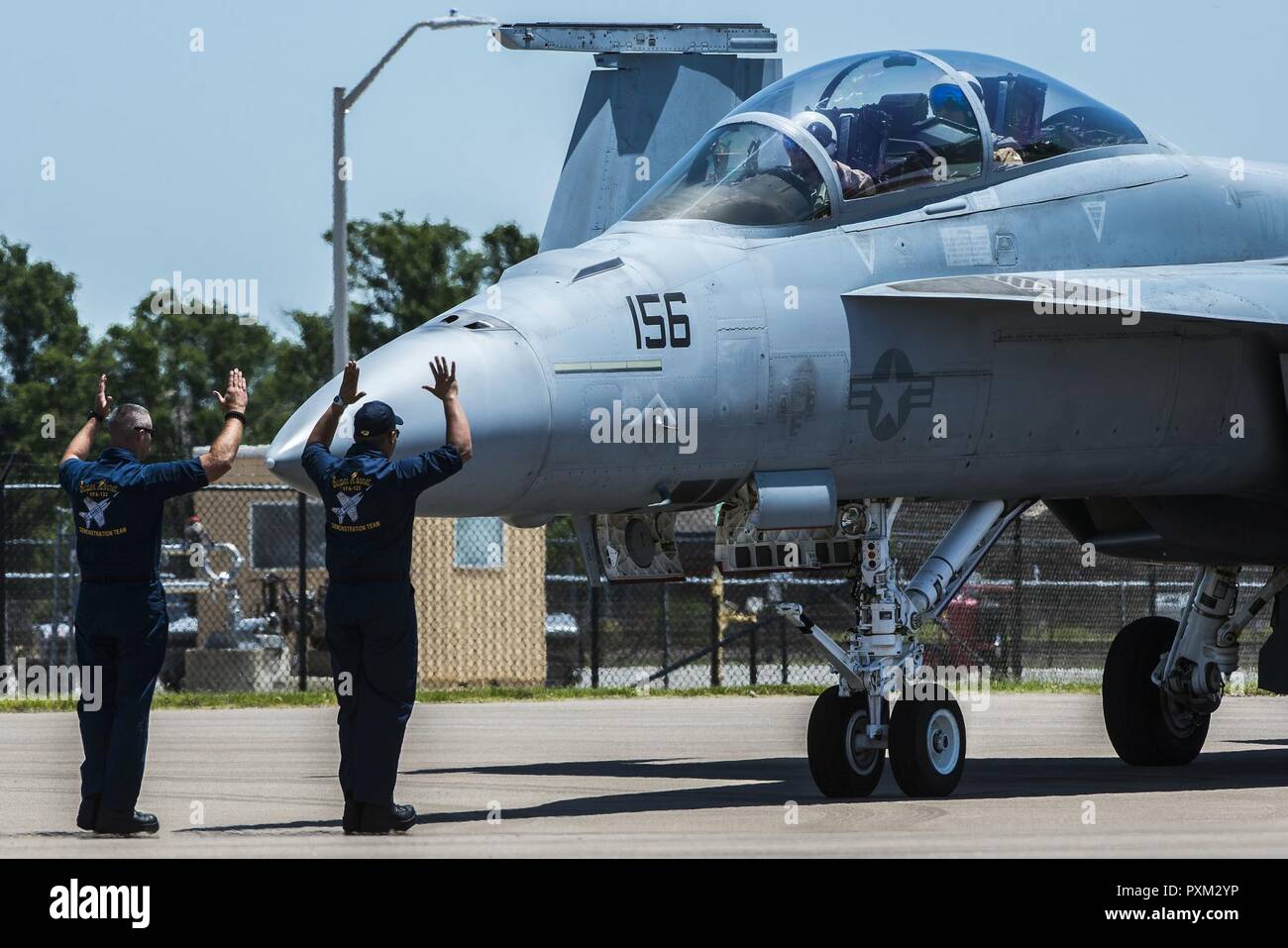 Members of the U.S. Navy Tactical Demonstration Team check the outer ...