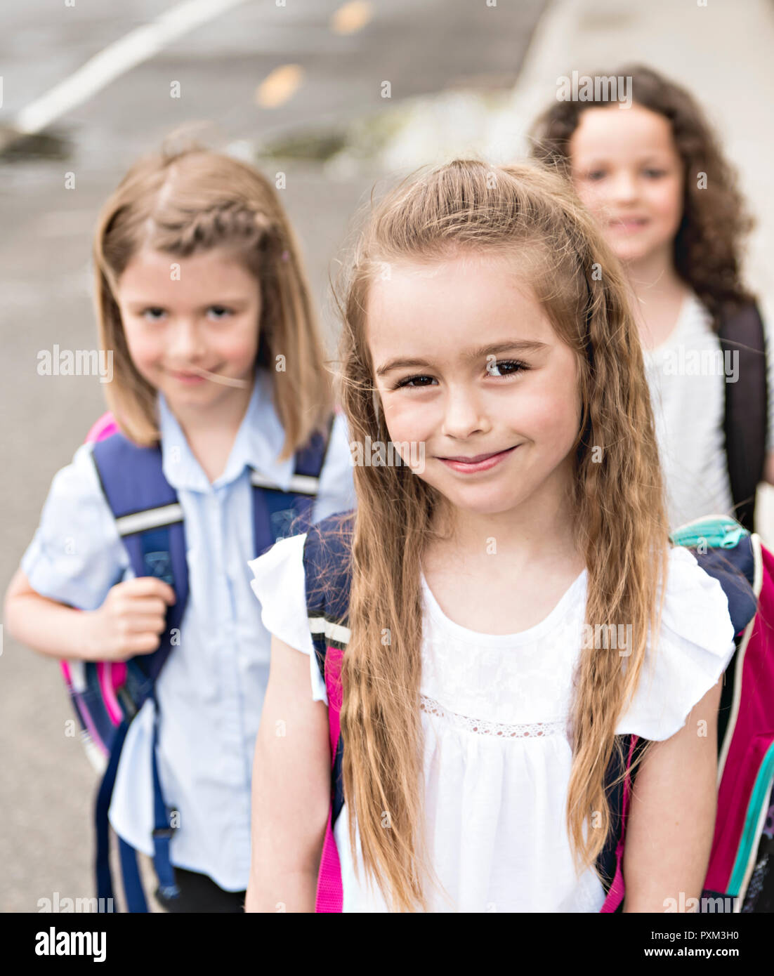 Group of students outside at school standing together Stock Photo - Alamy