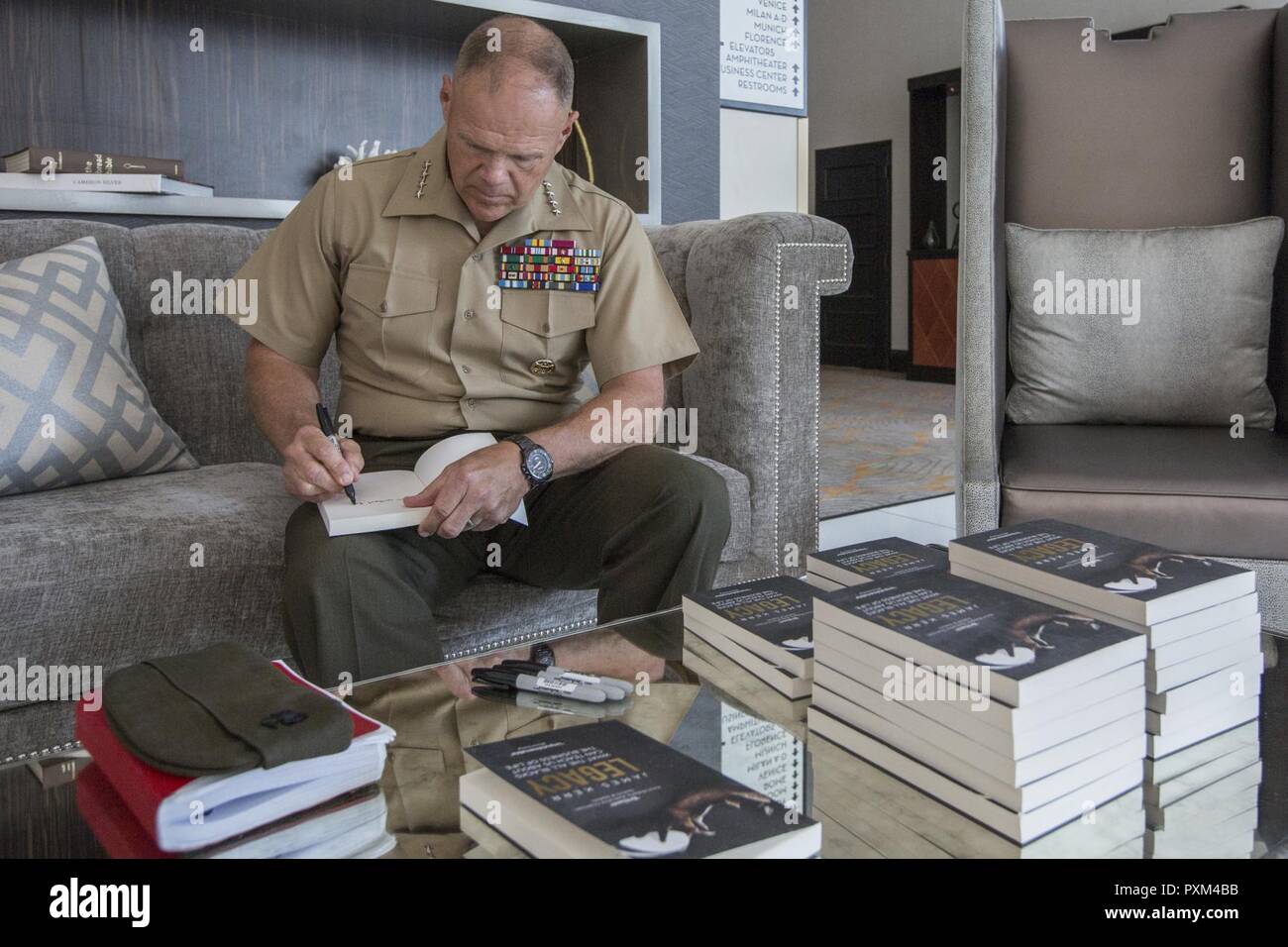 Commandant of the Marine Corps Gen. Robert B. Neller signs books after ...