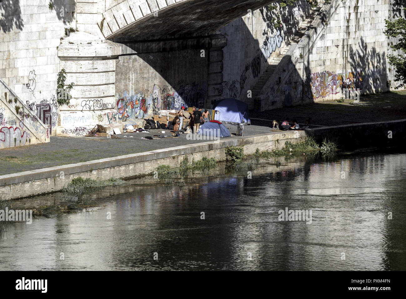 Homeless people under bridge in hi-res stock photography and images - Alamy