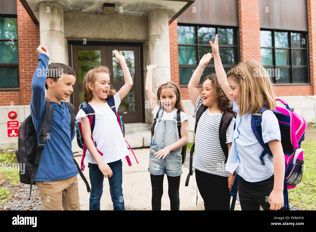 Group of students outside at school standing together Stock Photo - Alamy