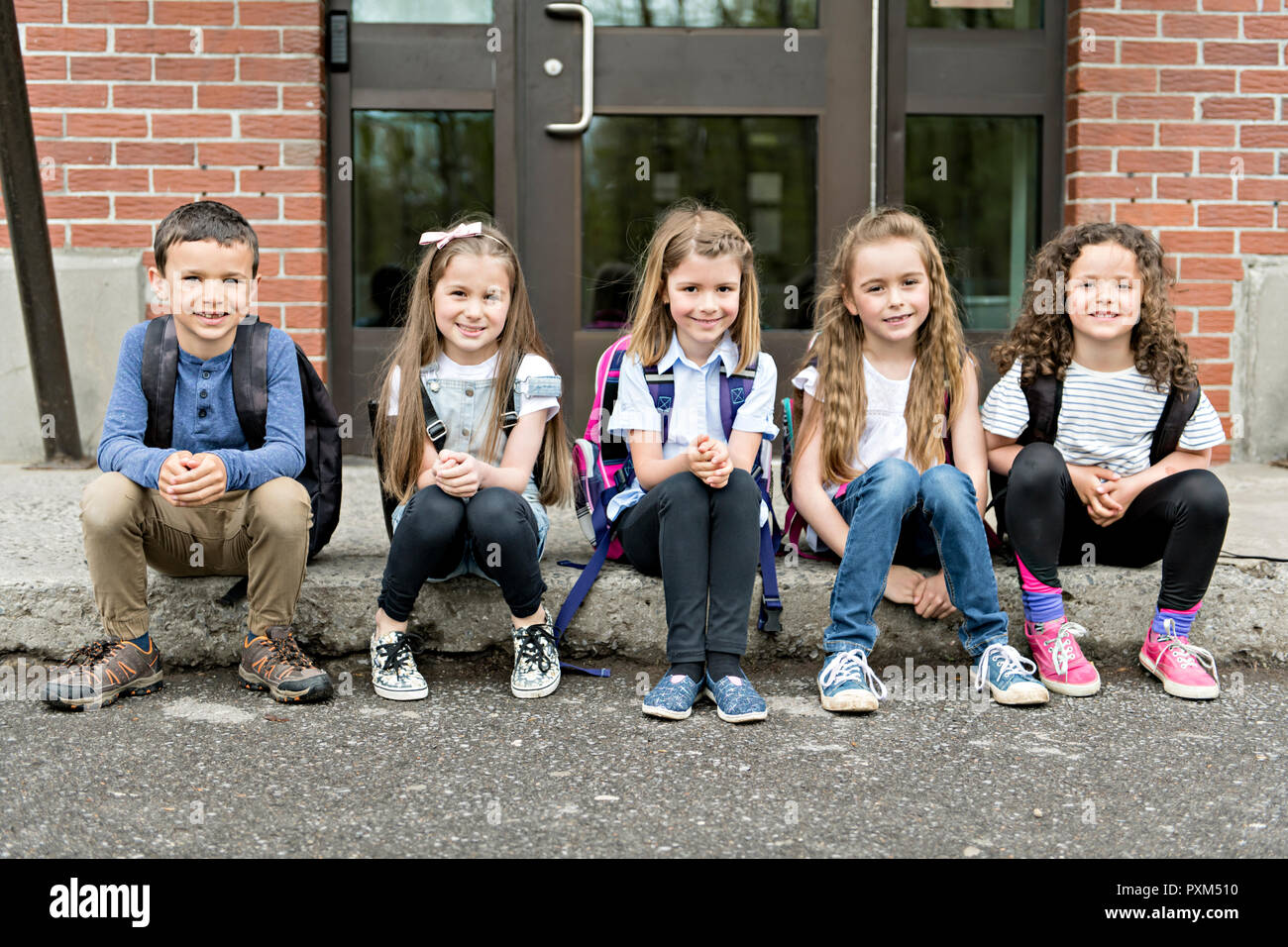 Group of students outside at school standing together Stock Photo - Alamy