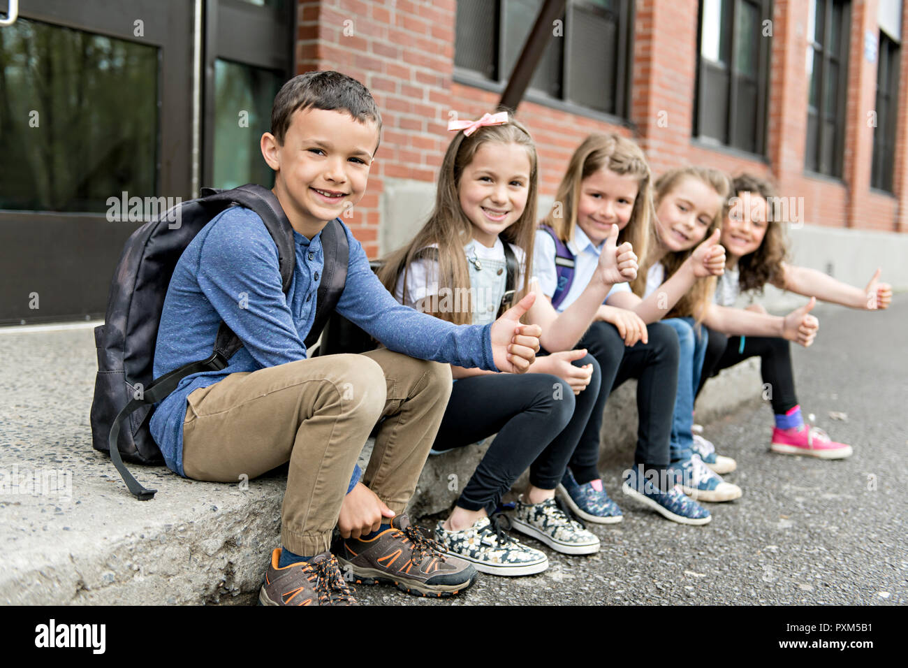 Group of students outside at school standing together Stock Photo - Alamy