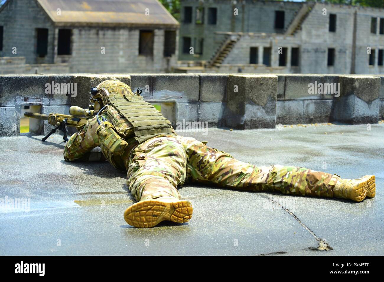 An Army Ranger sniper sets up a shot during the capabilities exercise ...