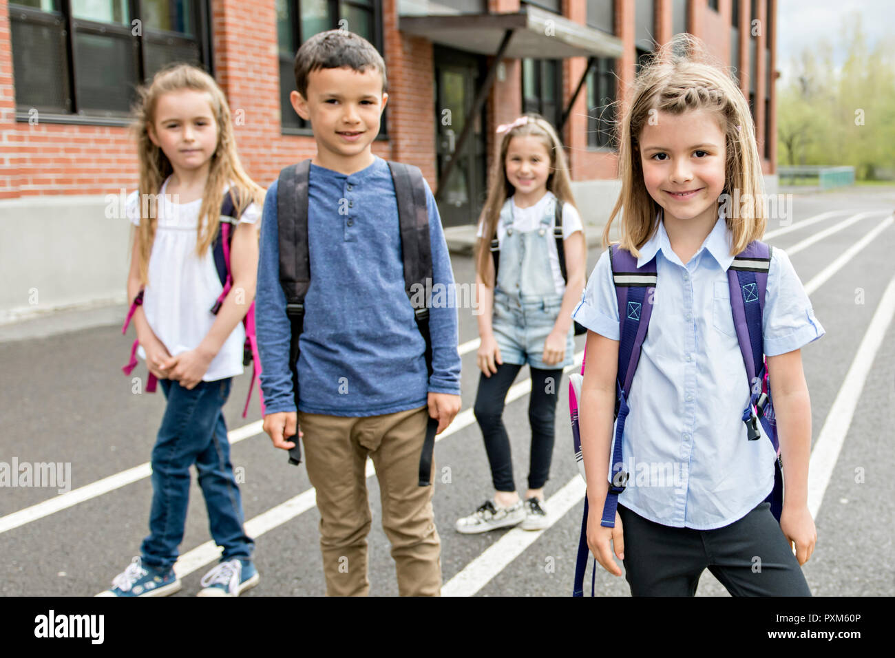 Group of students outside at school standing together Stock Photo - Alamy
