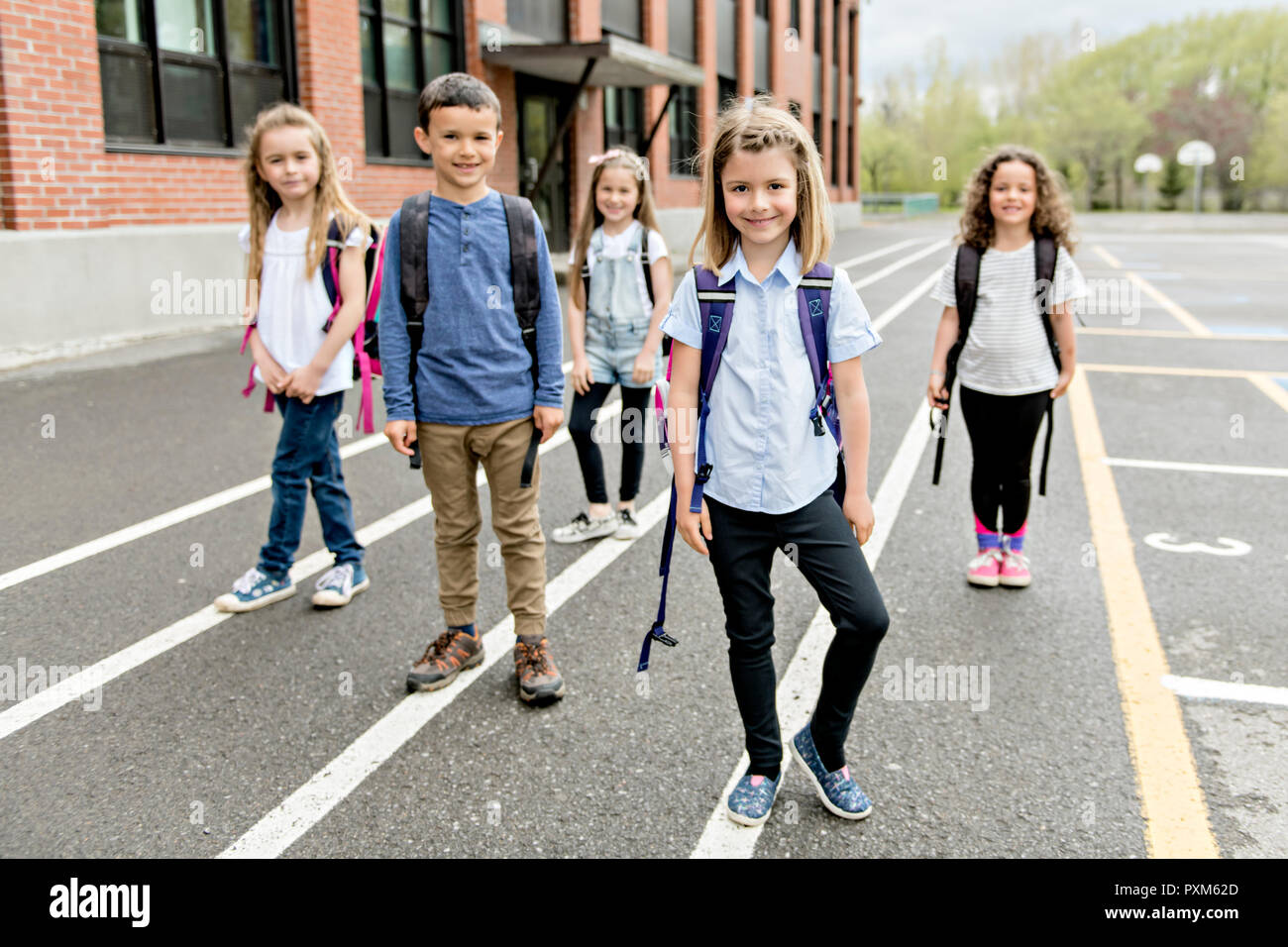 Group of students outside at school standing together Stock Photo - Alamy