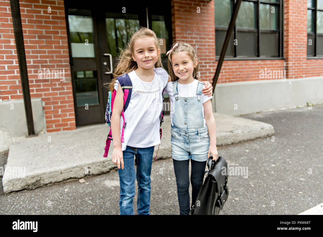 A group of Two students outside at school standing together Stock Photo ...
