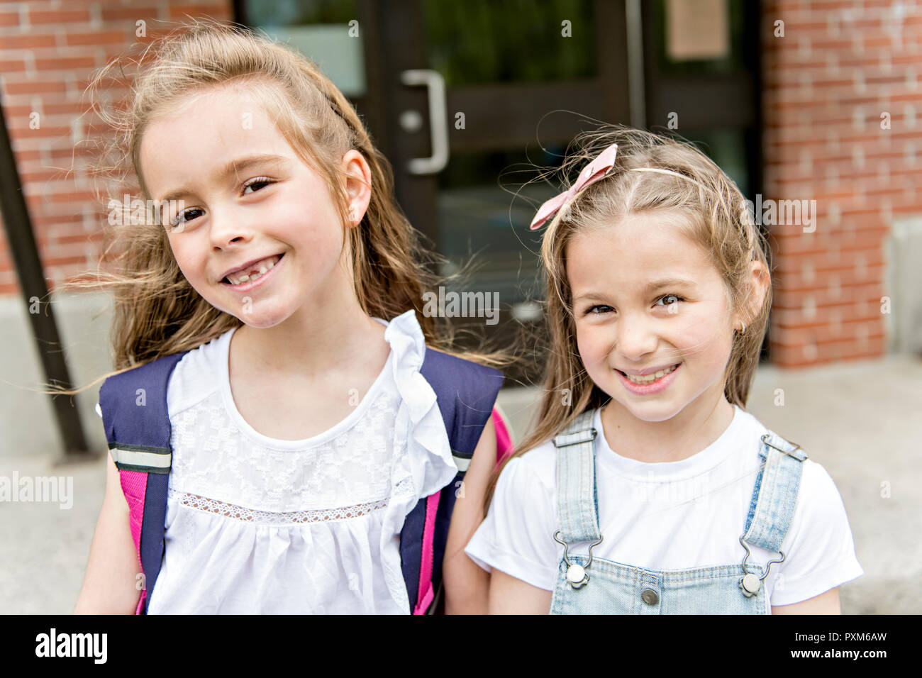 A group of Two students outside at school standing together Stock Photo ...
