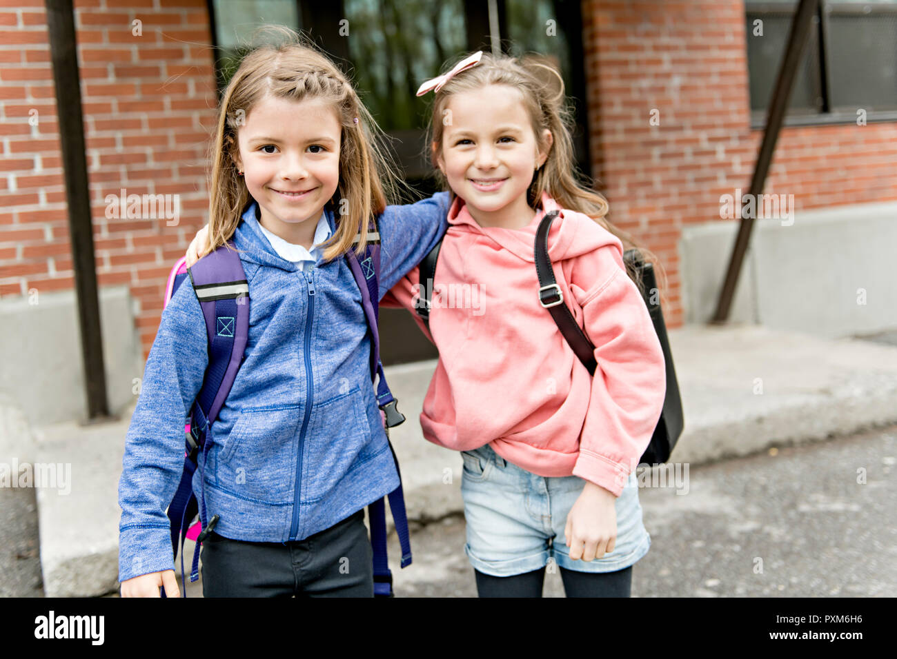 A group of Two students outside at school standing together Stock Photo ...