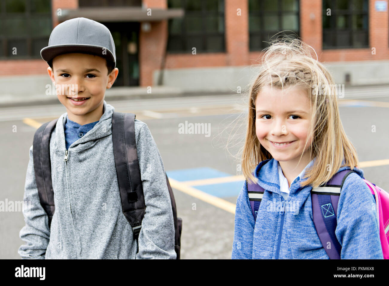 A group of Two students outside at school standing together Stock Photo ...