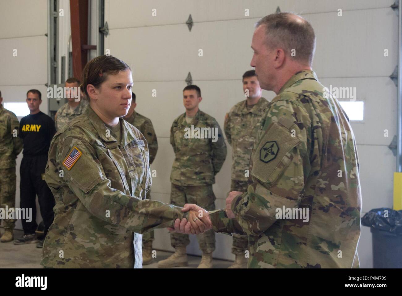Sgt. Joanne Hill, with the 96th Sustainment Brigade, is recognized as a ...