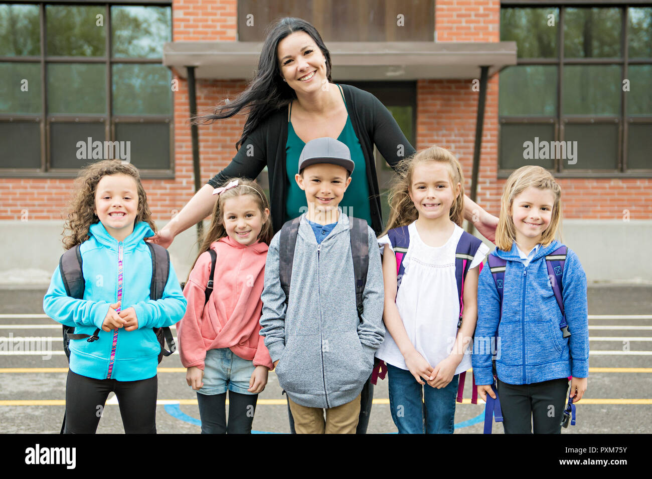 Group of students outside at school standing together Stock Photo - Alamy