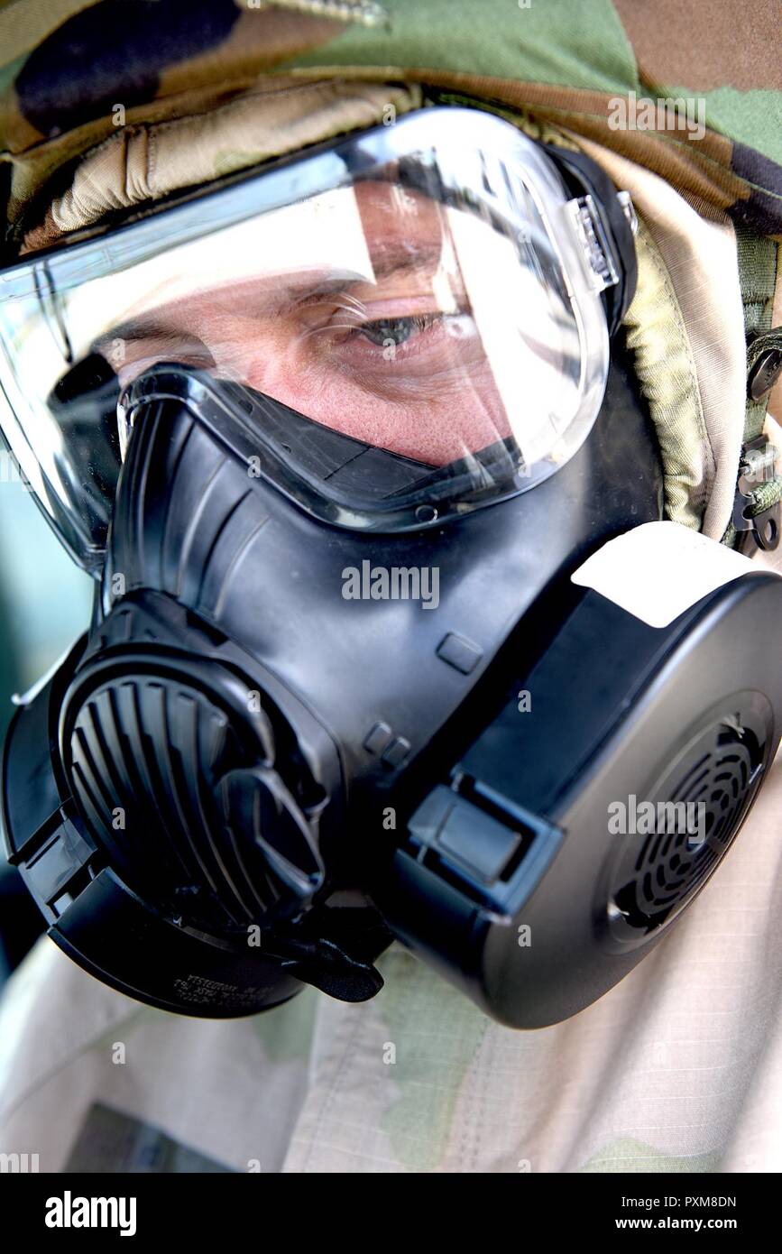 Airmen from the 124th Fighter Wing quickly don the MOPP4 chemical ...