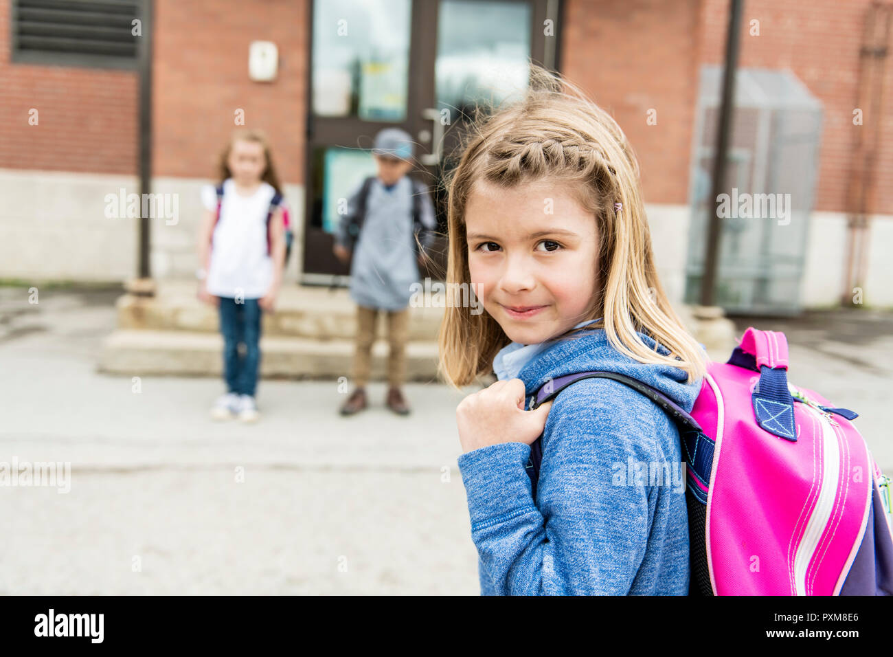 Group of students outside at school standing together Stock Photo - Alamy