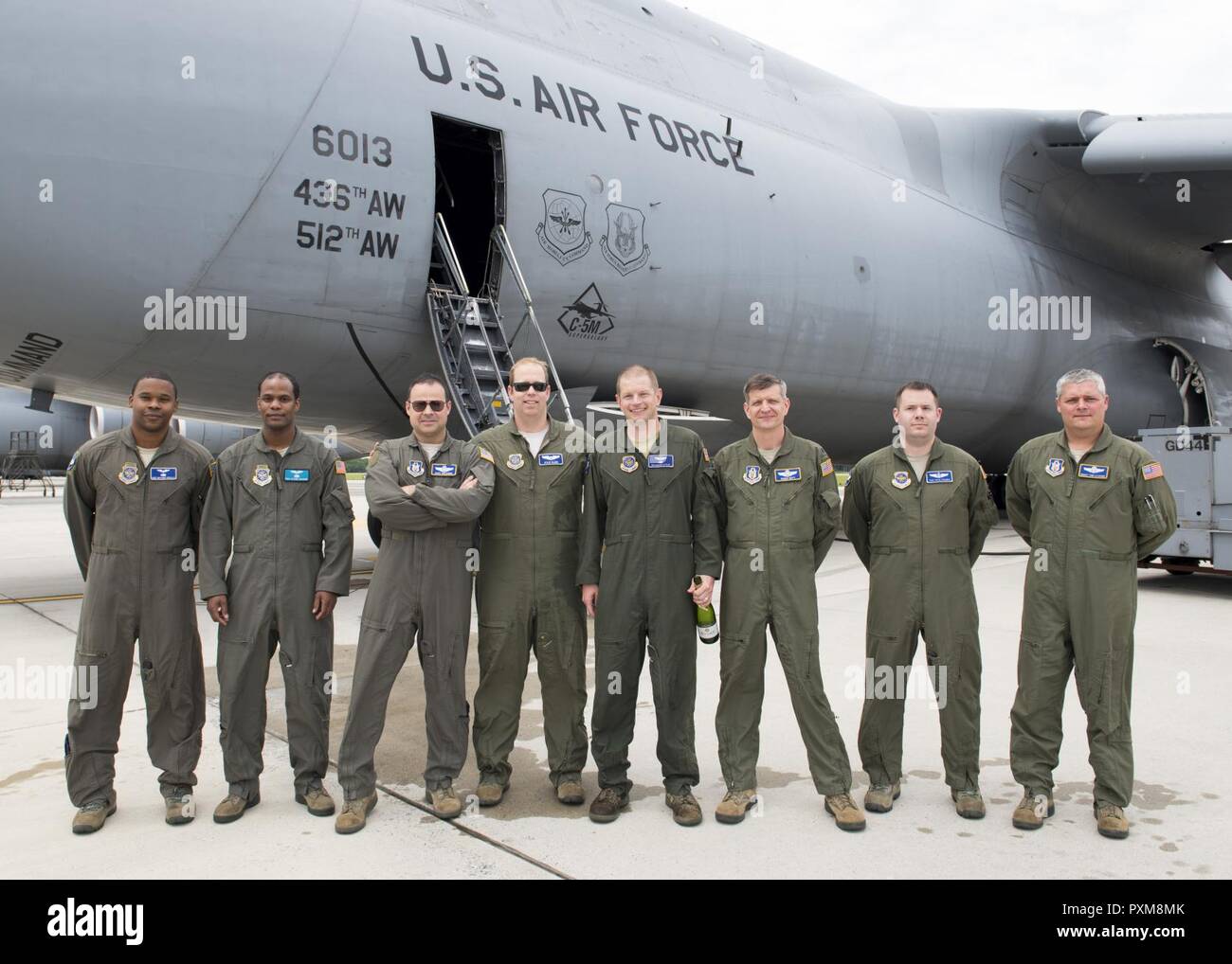 A C-5M Super Galaxy aircrew poses for a photo after the final C-5M ...