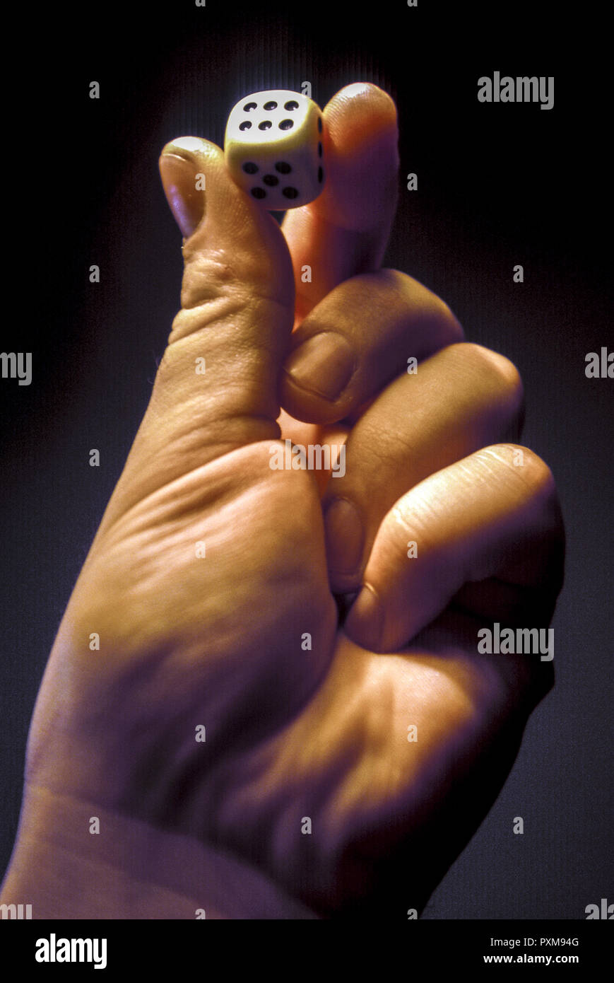 hand holding dice Stock Photo - Alamy