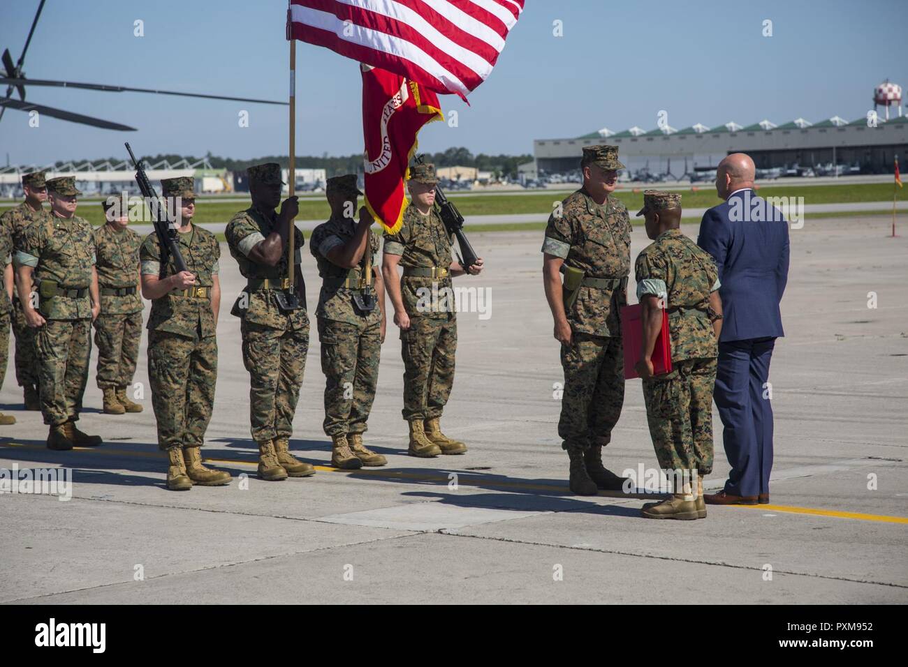 U.S. Marine Corps Lt. Col. Christian M. Ward, center, former commanding ...
