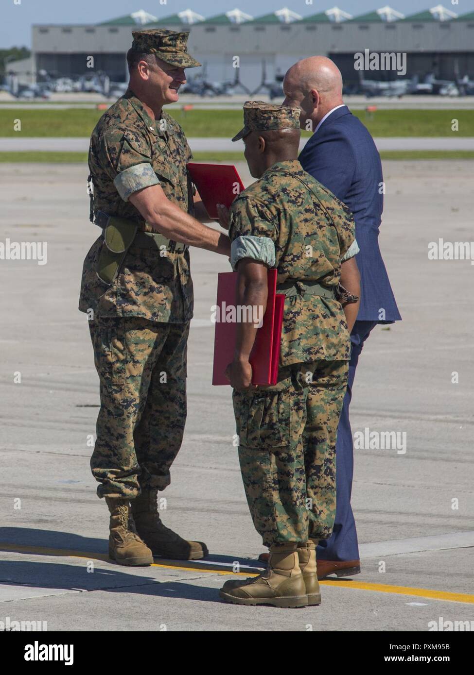 U.S. Marine Corps Lt. Col. Christian M. Ward left, former commanding ...