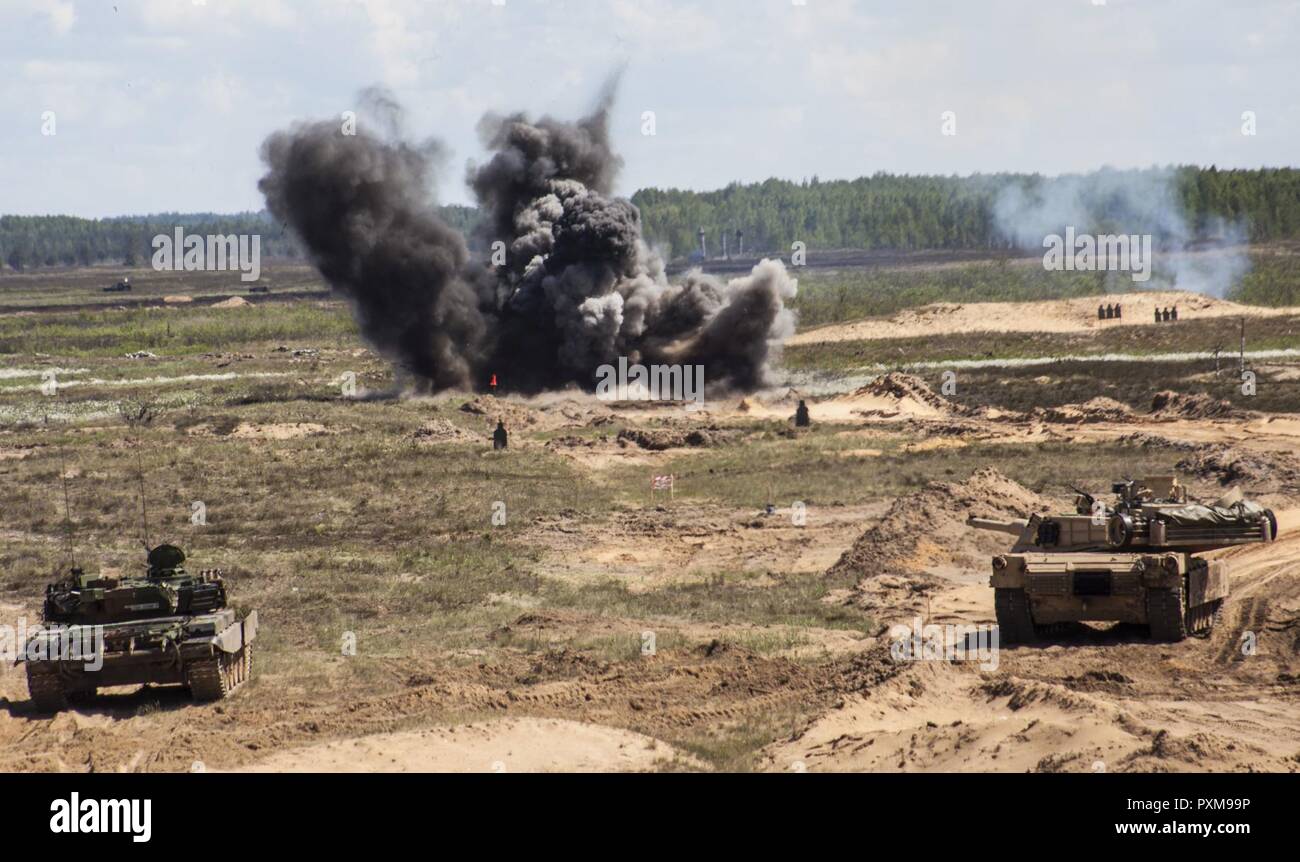 ADAZI, Latvia-- Polish soldiers operate PT-91 Twardy tanks alongside U ...