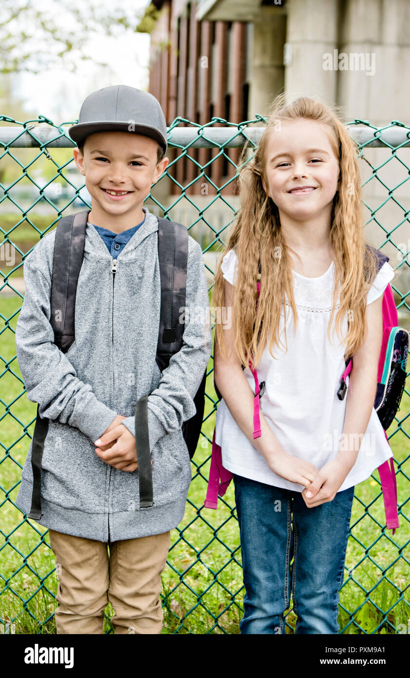 Group of students outside at school standing together Stock Photo - Alamy