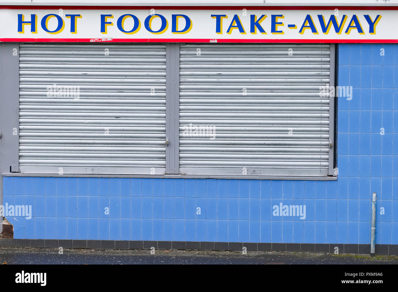 Hot fast food takeaway cafe metal shutters closed Stock Photo - Alamy