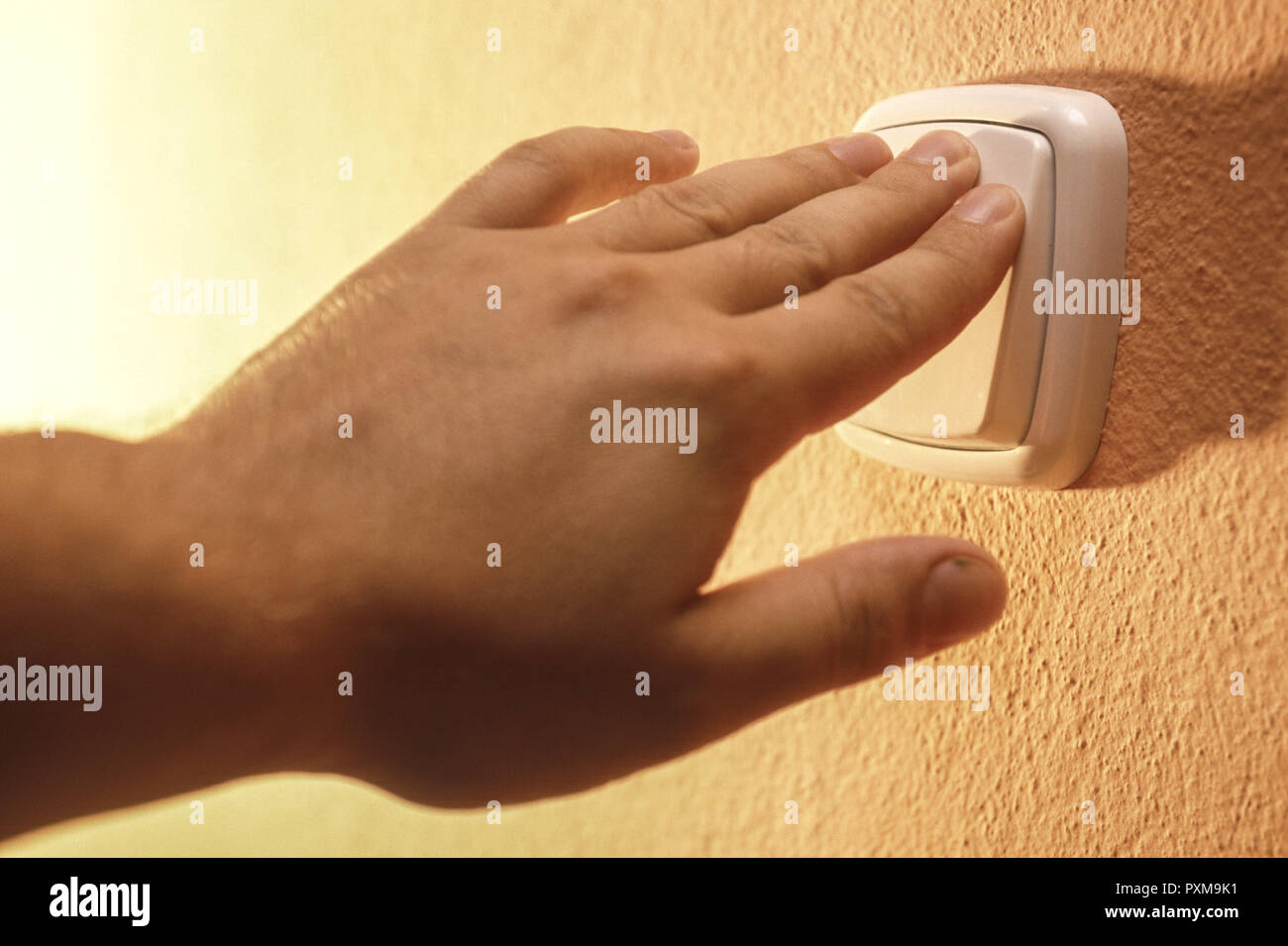 hands on light switch Stock Photo - Alamy
