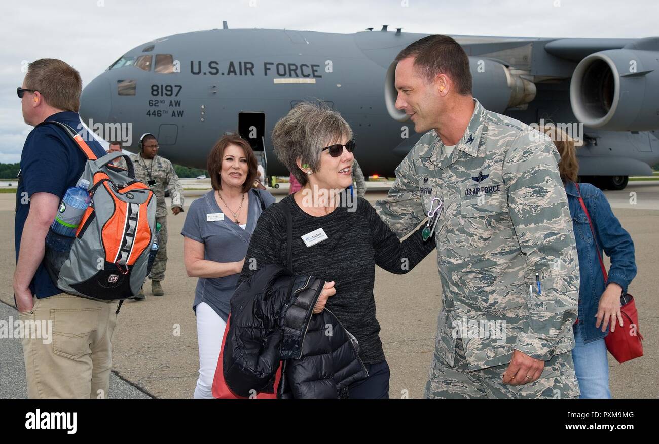 Col. Ethan Griffin, 436th Airlift Wing commander, greets Carlene Joseph ...