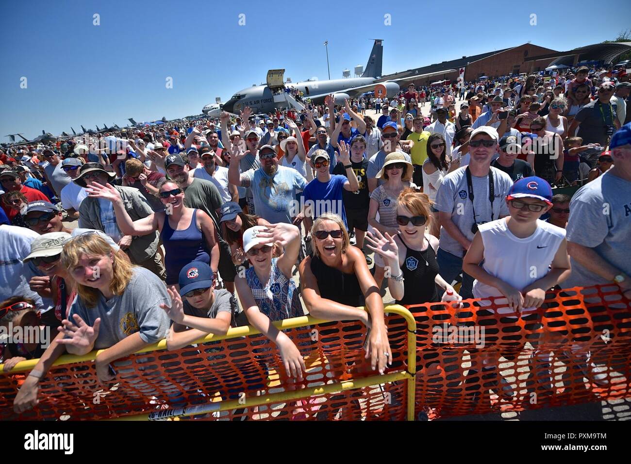 Smiles and waves from the crowd of Scott Centennial Airshow attendees ...