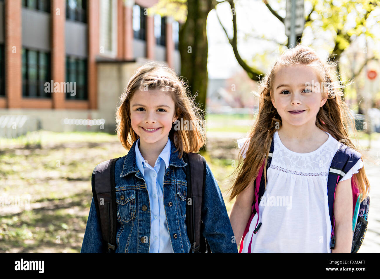 A group of Two students outside at school standing together Stock Photo ...