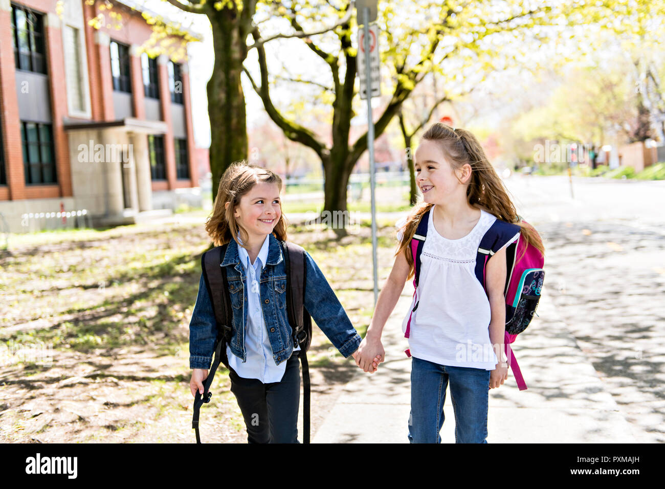 A group of Two students outside at school standing together Stock Photo ...