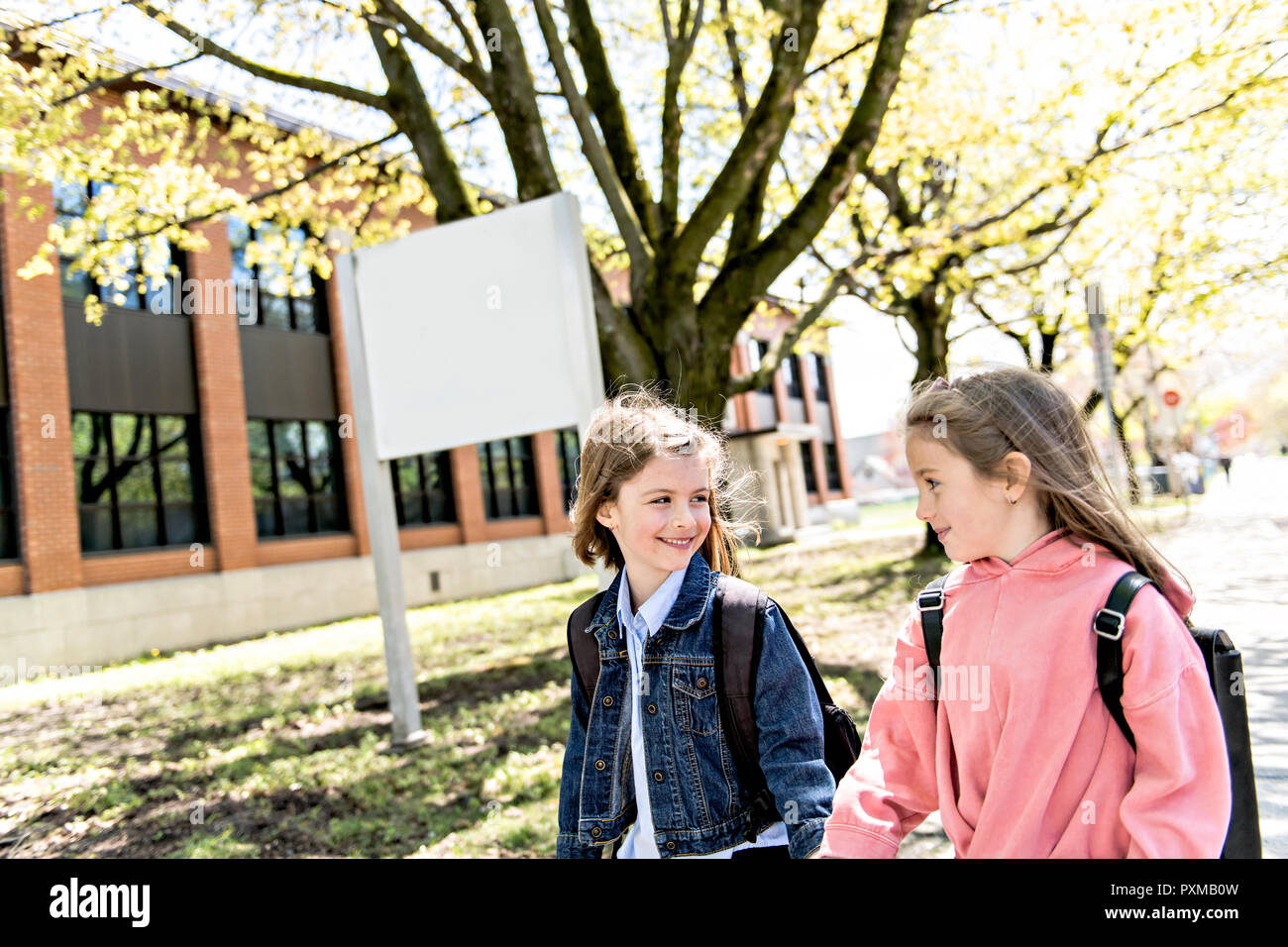 A group of Two students outside at school standing together Stock Photo ...