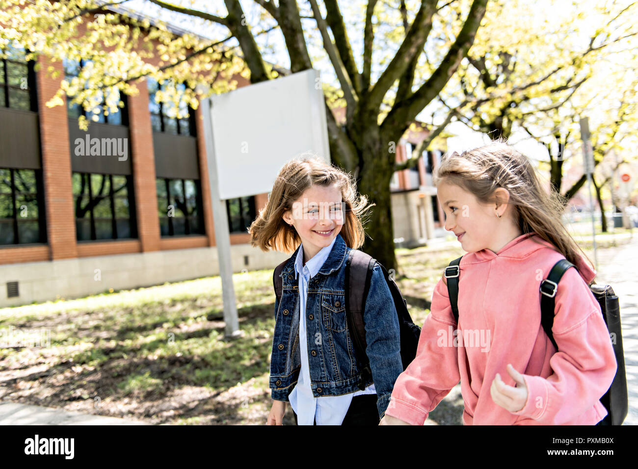A group of Two students outside at school standing together Stock Photo ...