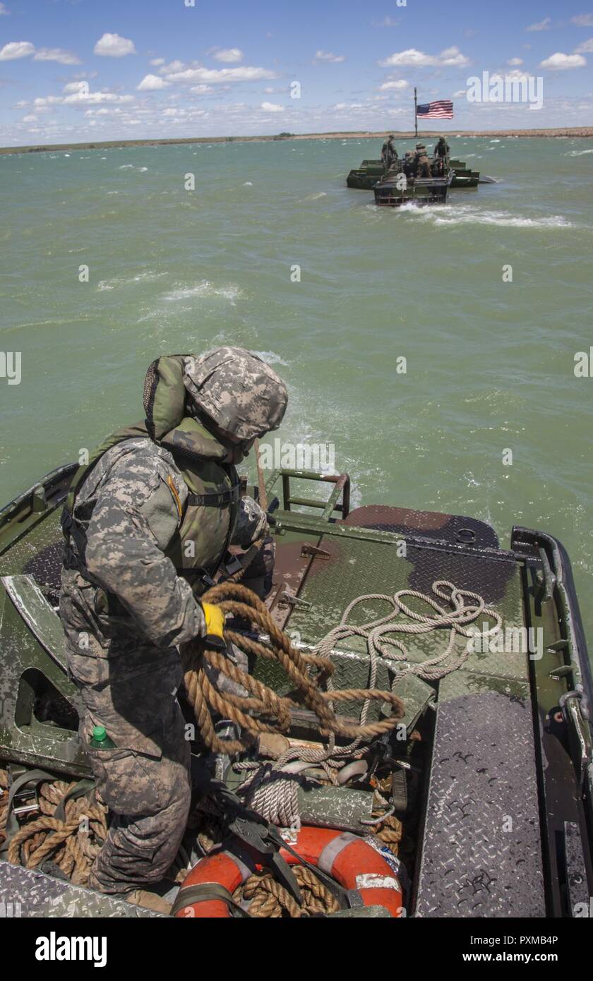 U.S. Army Spc. Benjamin Beyer (left) with the 200th Engineer Company ...