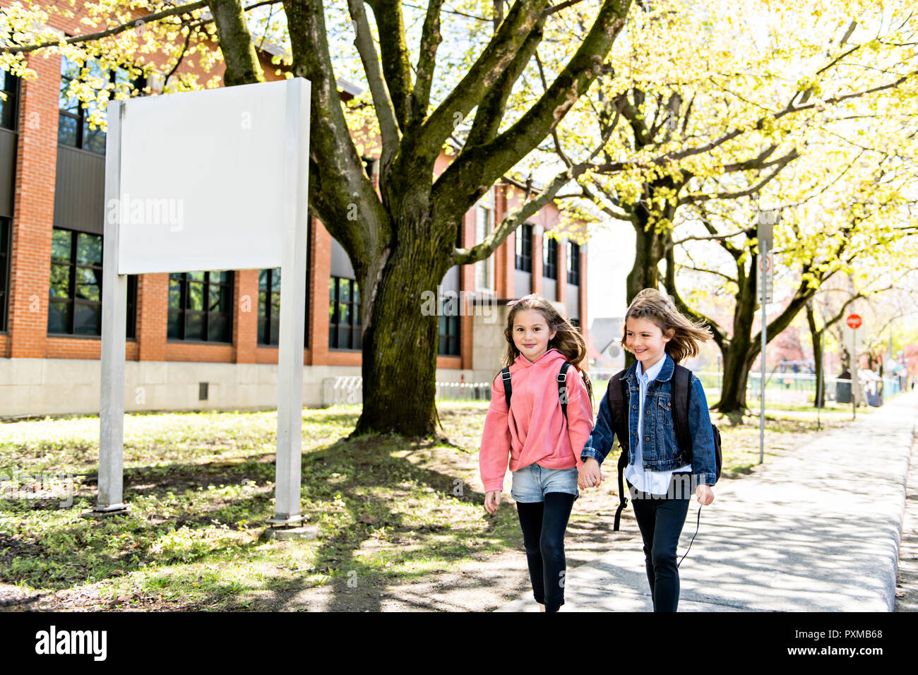A group of Two students outside at school standing together Stock Photo ...