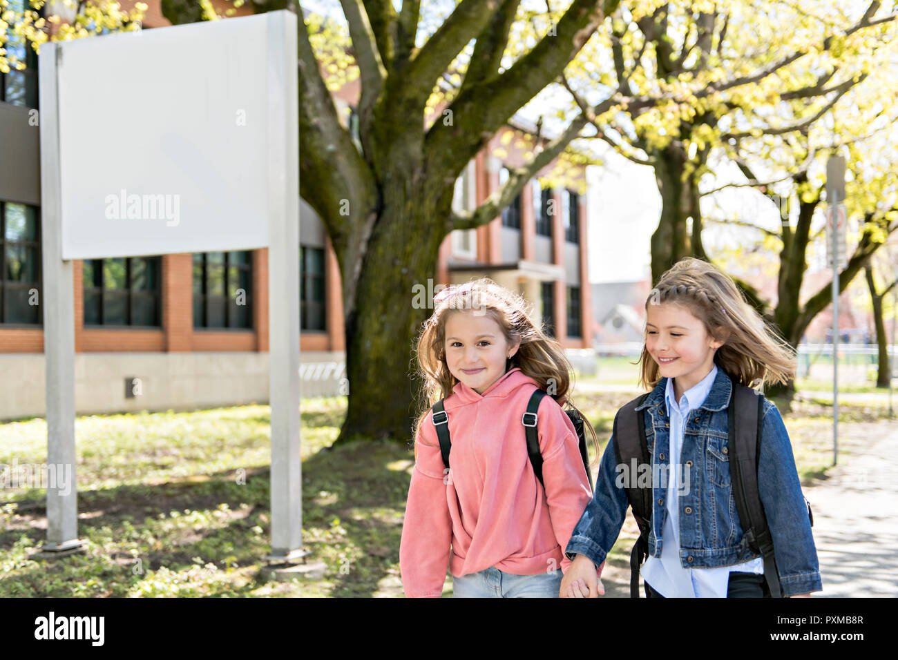 A group of Two students outside at school standing together Stock Photo ...