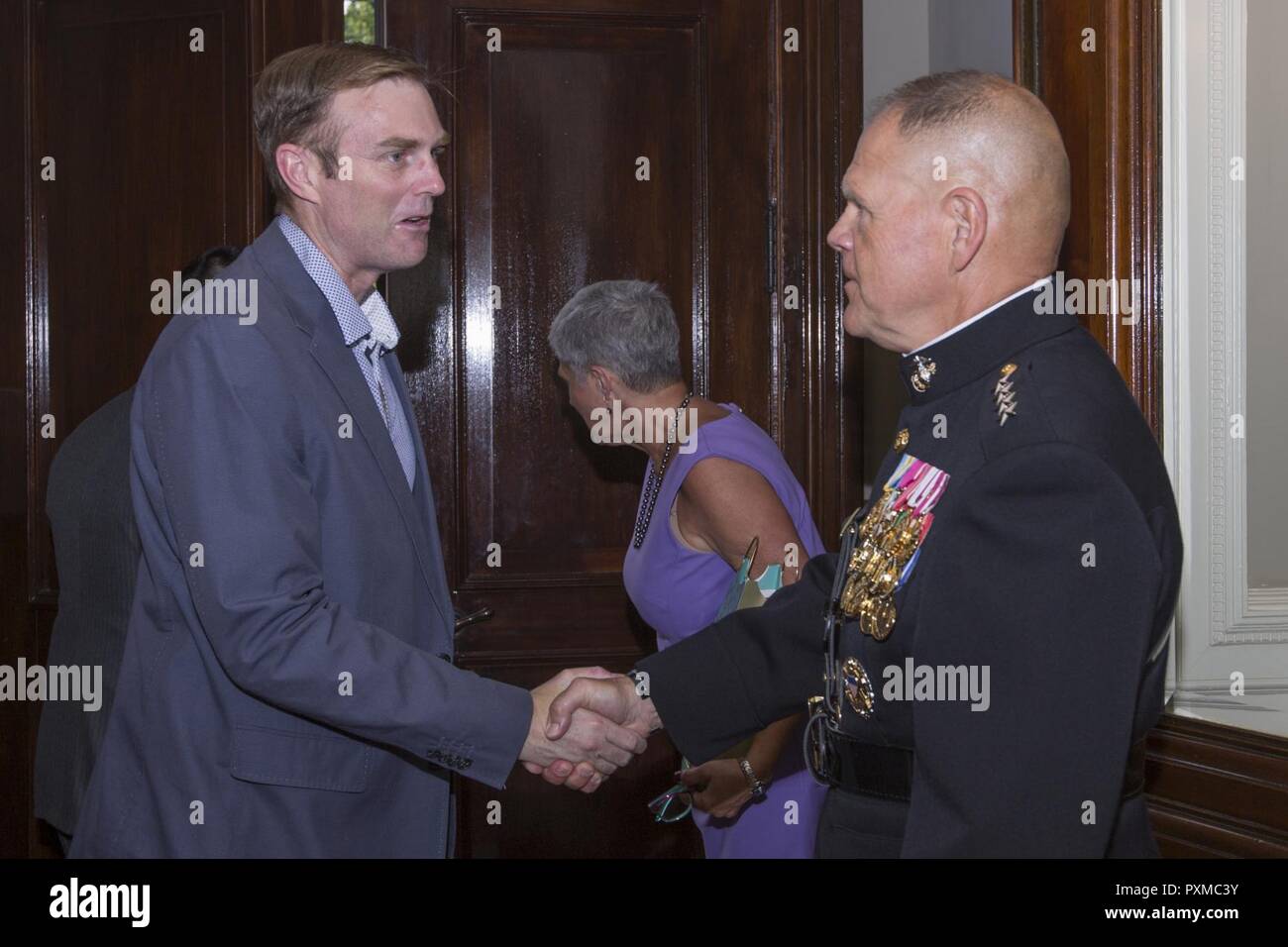 Commandant of the Marine Corps Gen. Robert B. Neller, right, shakes ...