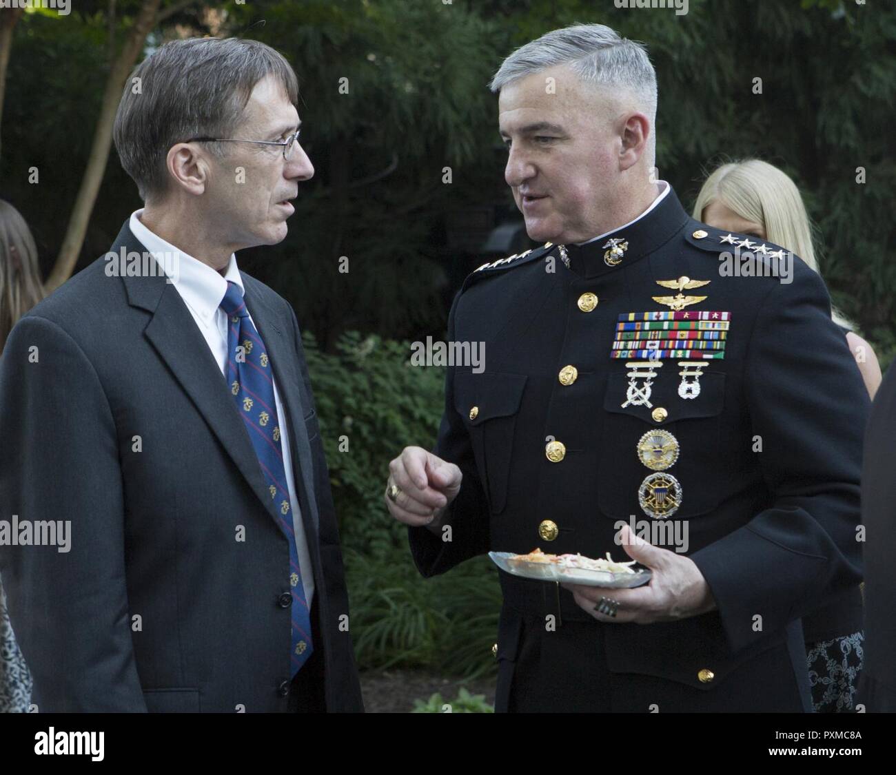 Secretary of the Navy the Honorable Sean J. Stackley, left, speaks to ...