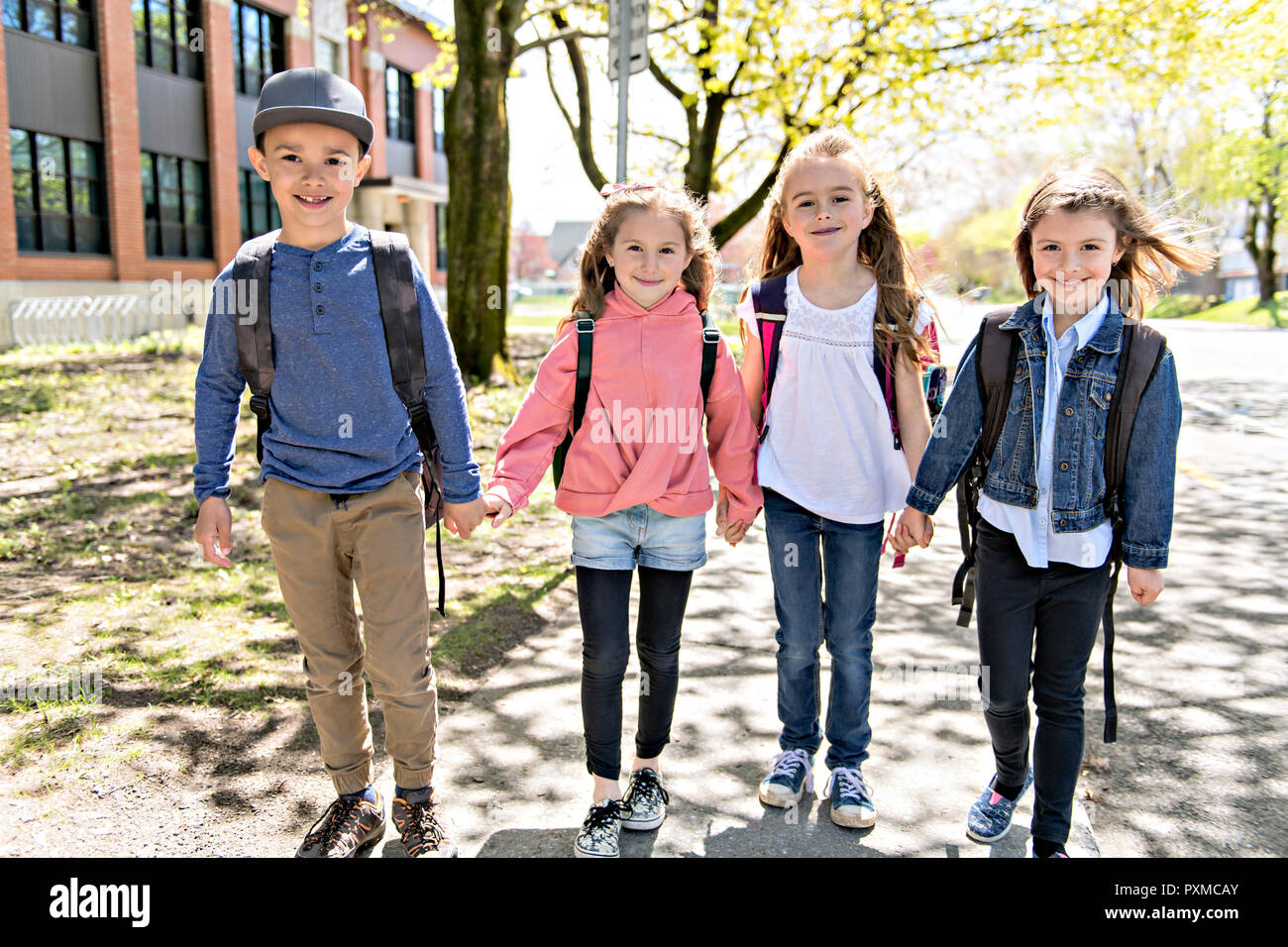 Group of students outside at school standing together Stock Photo - Alamy