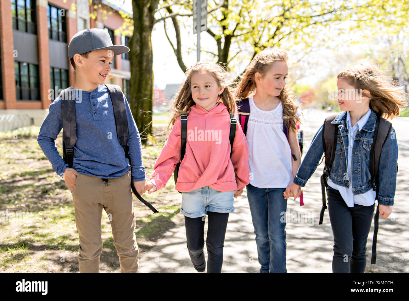 Group of students outside at school standing together Stock Photo - Alamy