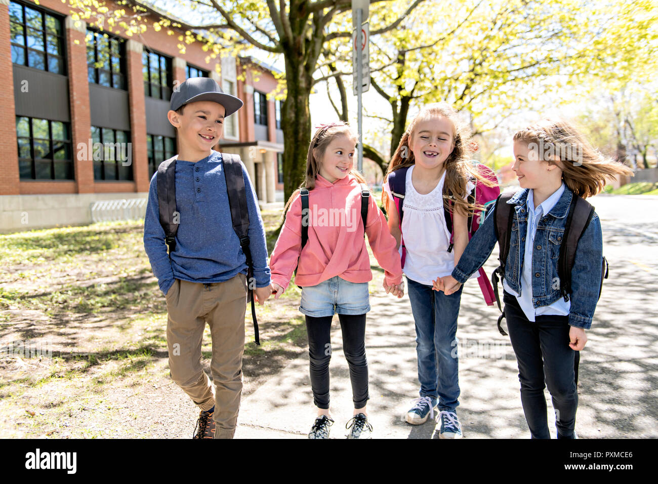 Group of students outside at school standing together Stock Photo - Alamy