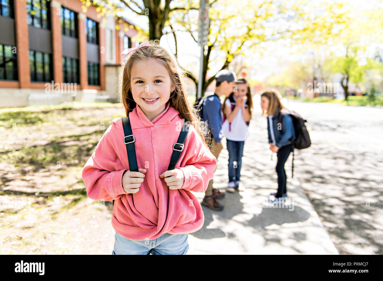 Group of students outside at school standing together Stock Photo - Alamy