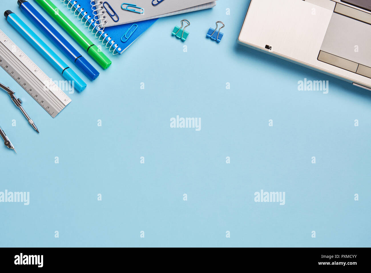 On the table are notebooks, pencils, pens, ruler, computer and other ...