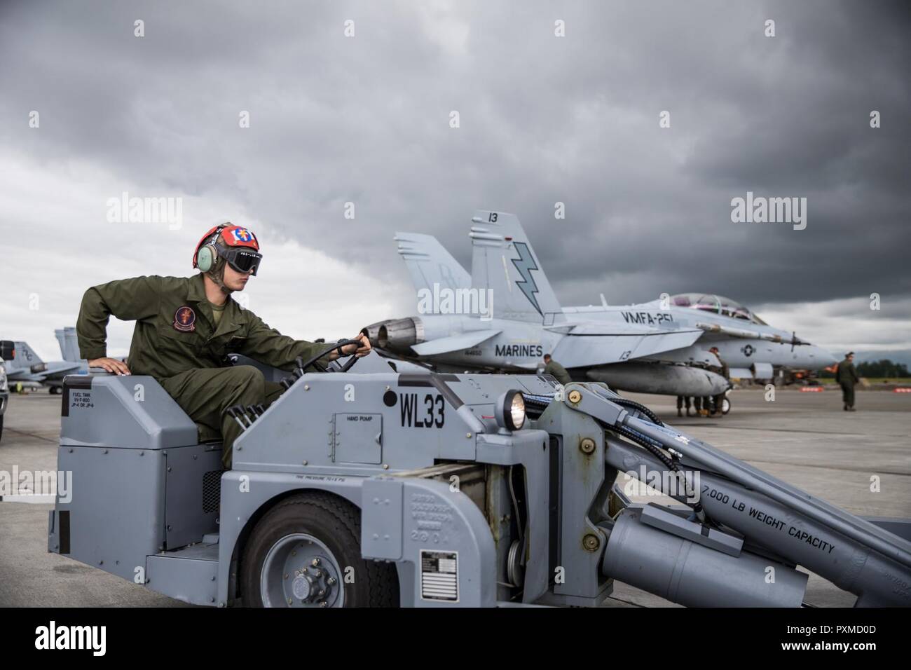 U.S. Marine Corps Lance Cpl. Douglas Gainer, an aviation ordnance ...