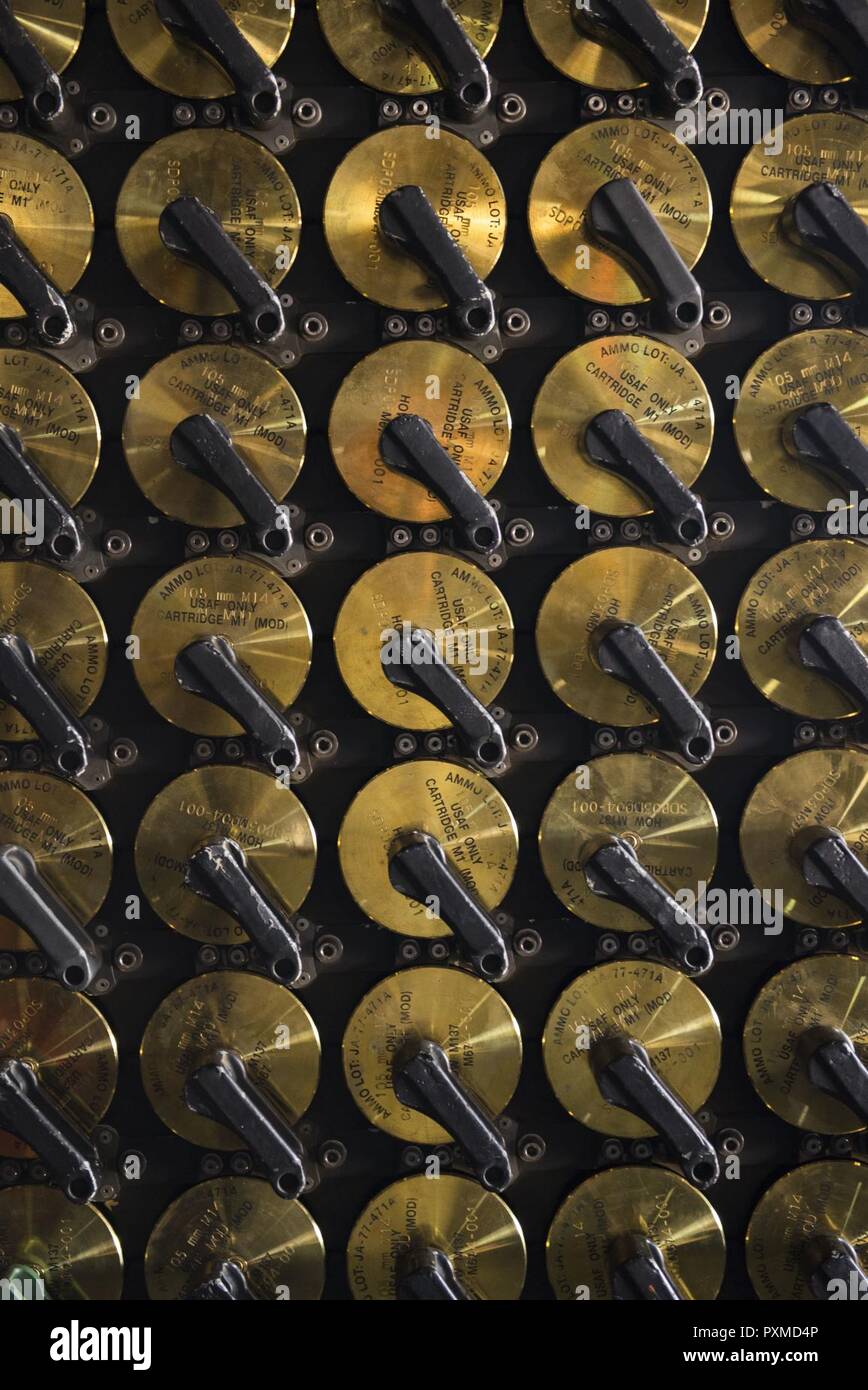 105mm rounds sit in an ammunition rack aboard an AC-130W Stinger II ...