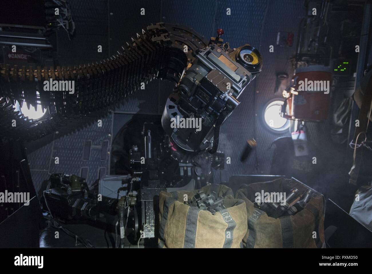 A bullet casing ejects from a 30mm gun aboard an AC-130W Stinger II at ...